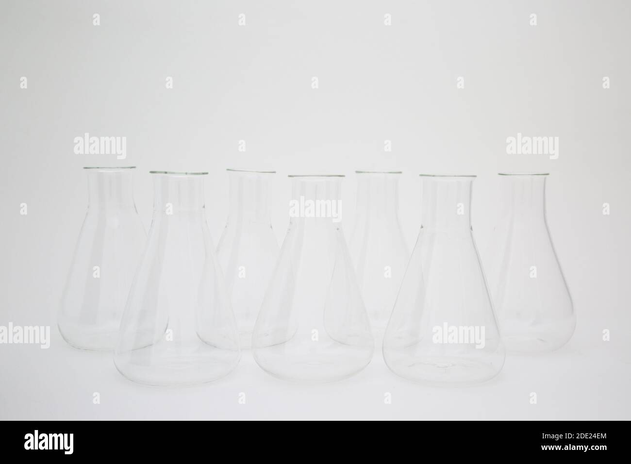 Group of scientific laboratory glass erlenmeyer flask isolated on white ...