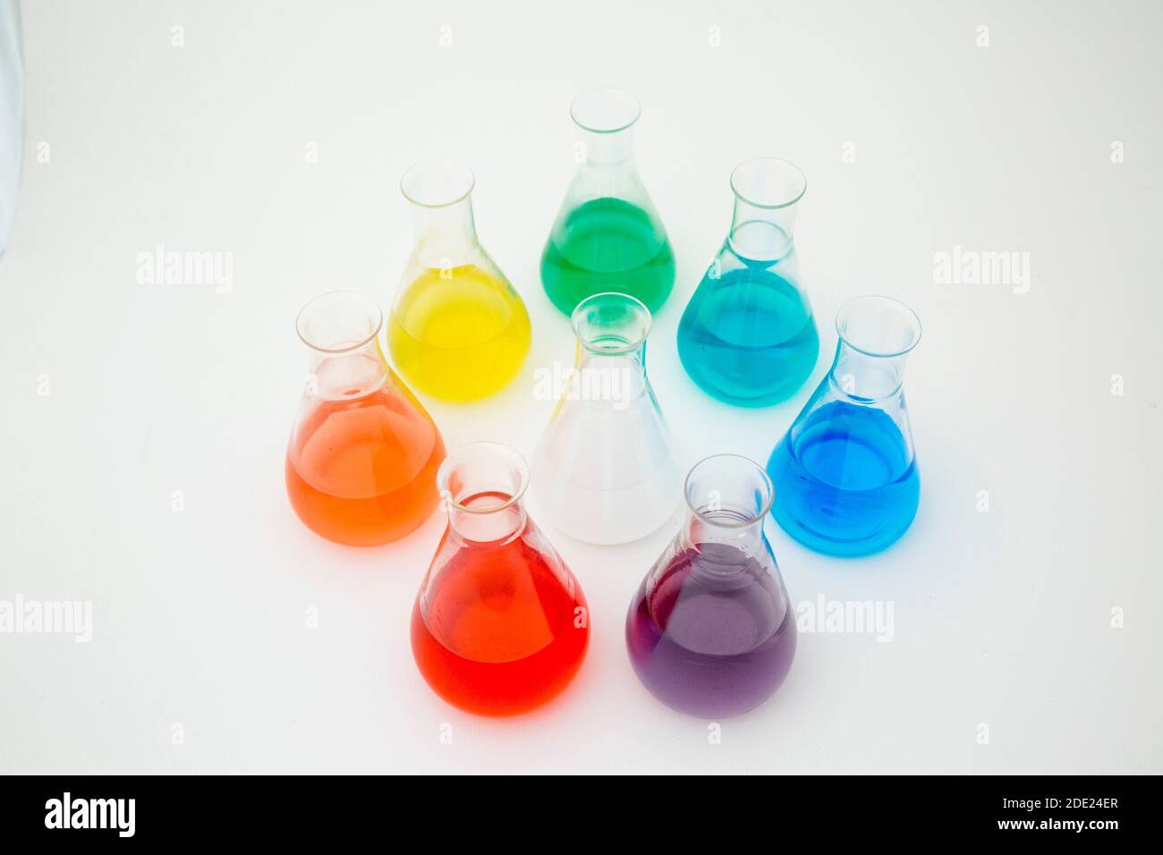 Scientific laboratory glass erlenmeyer flask filled with colorful ...
