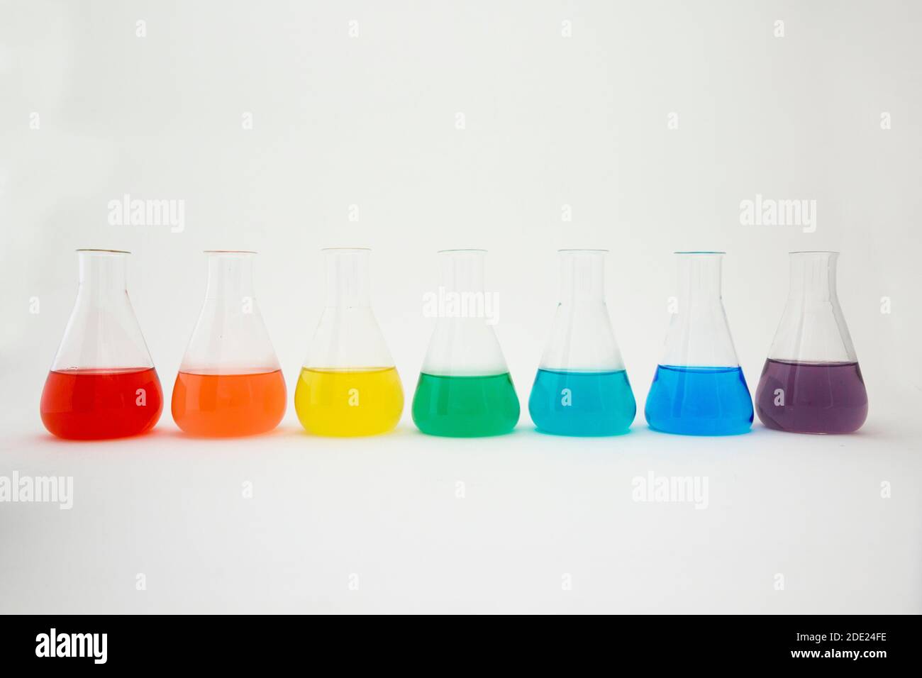 Scientific laboratory glass erlenmeyer flask filled with colorful ...