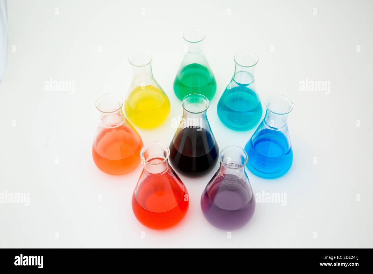 Scientific laboratory glass erlenmeyer flask filled with colorful ...