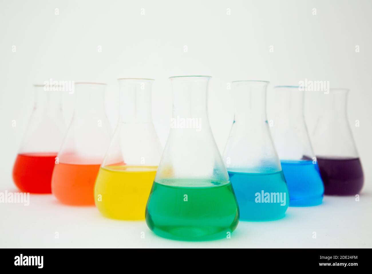 Scientific laboratory glass erlenmeyer flask filled with colorful ...