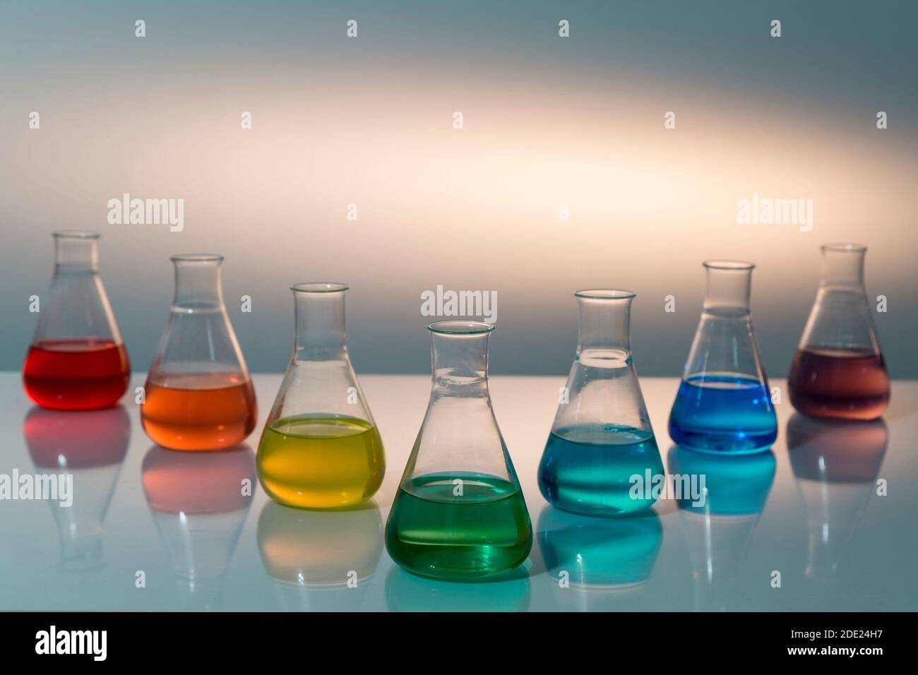 Scientific laboratory glass erlenmeyer flask filled with colorful ...