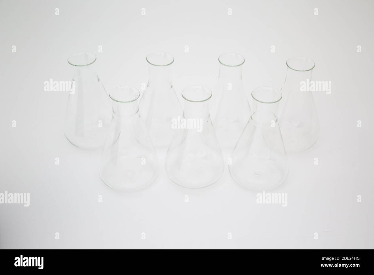 Group of scientific laboratory glass erlenmeyer flask isolated on white ...