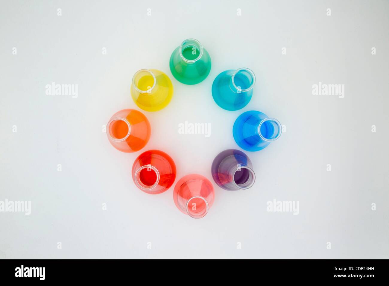 Scientific laboratory glass erlenmeyer flask filled with colorful ...