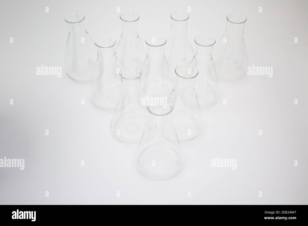 Group of scientific laboratory glass erlenmeyer flask isolated on white ...