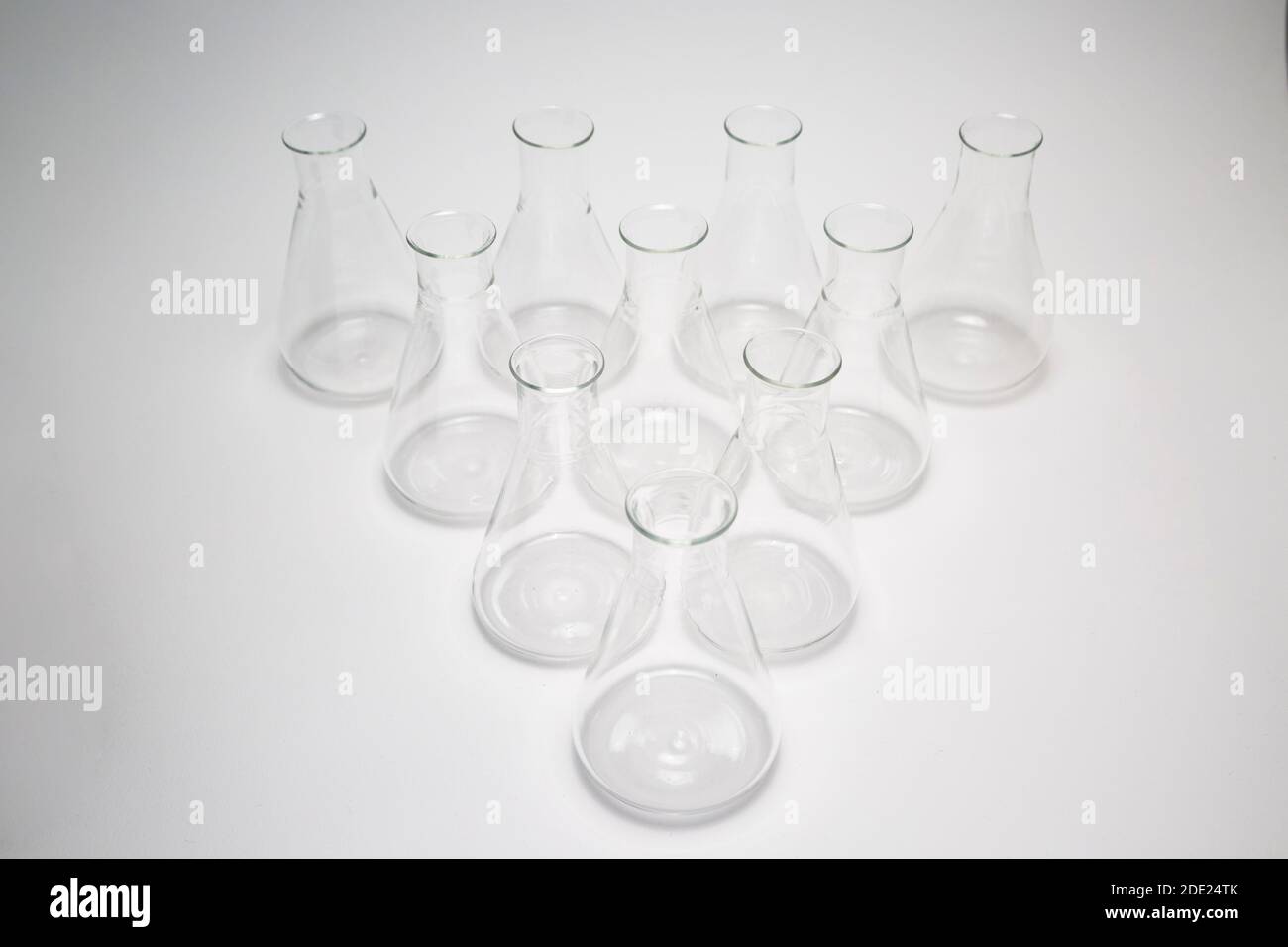 Group of scientific laboratory glass erlenmeyer flask isolated on white ...
