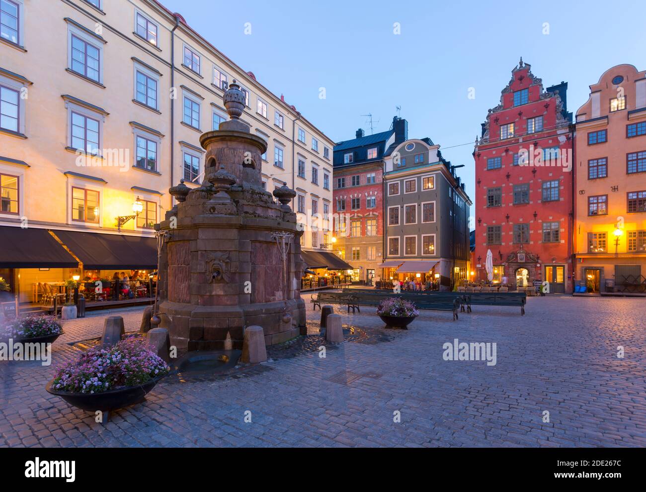 Restaurant and colourful buildings on Stortorget, Old Town Square in ...