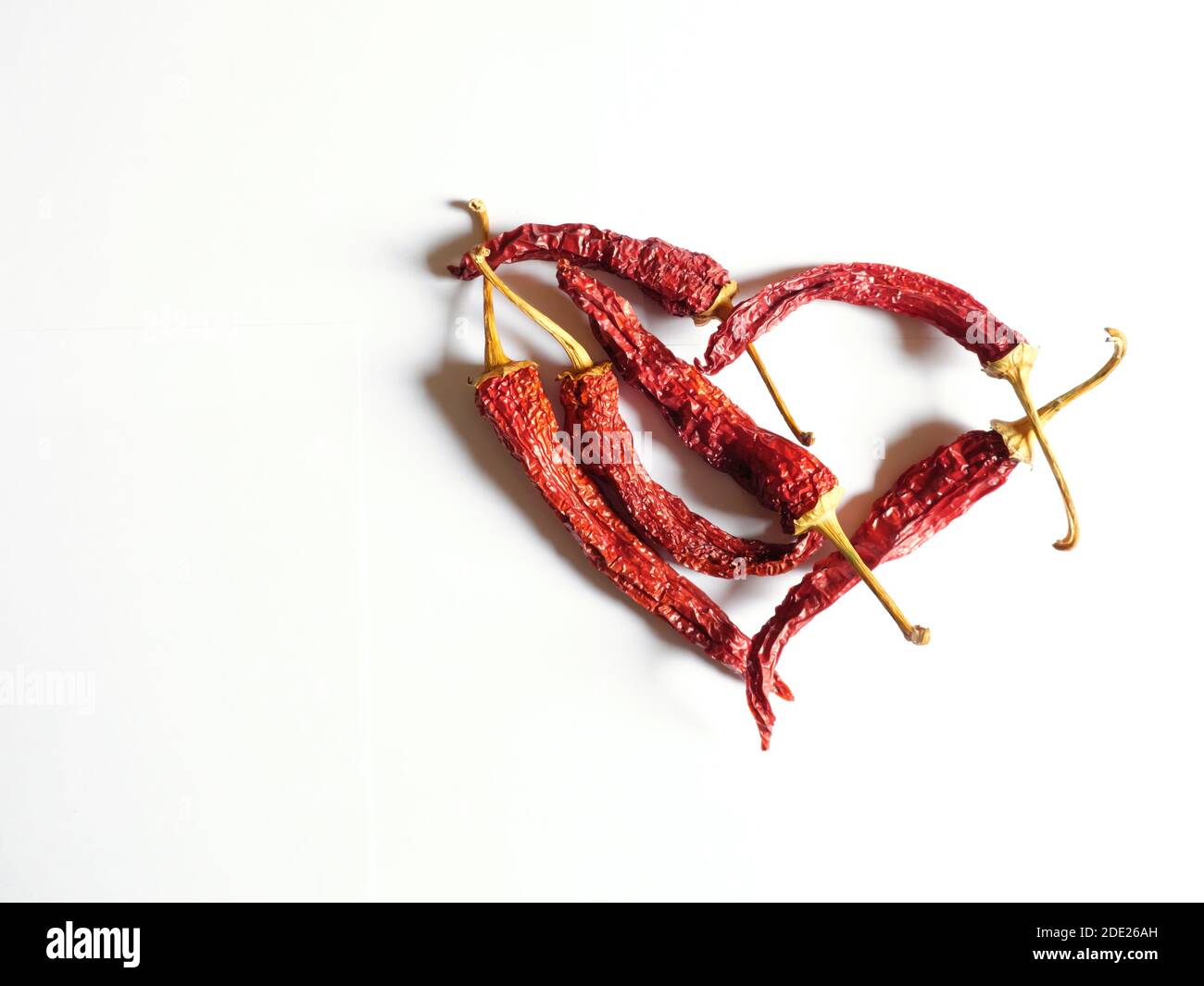 Red heart composed of red chili peppers on white background. Symbol of ...