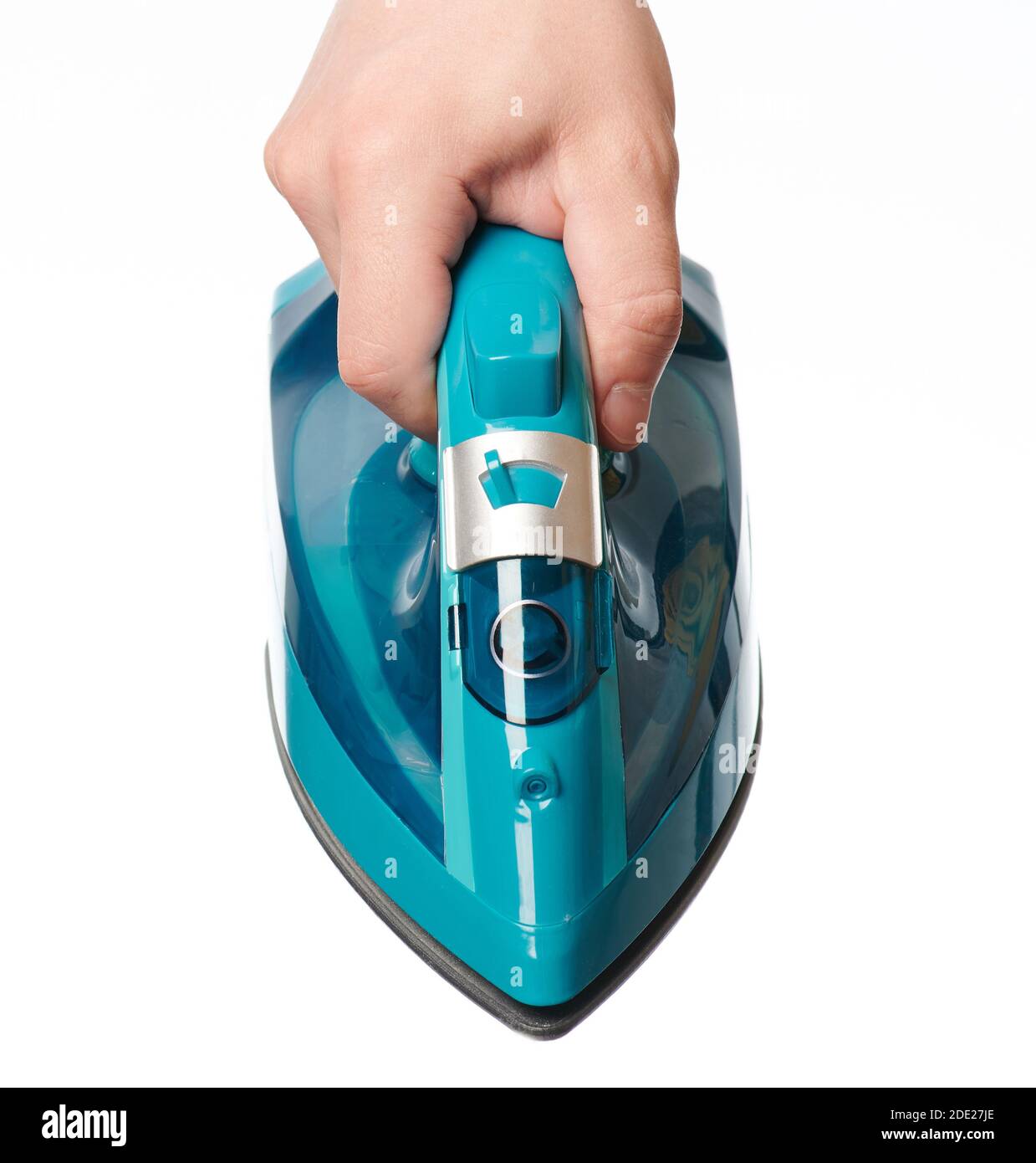 Blue modern iron in hand isolated front view Stock Photo - Alamy