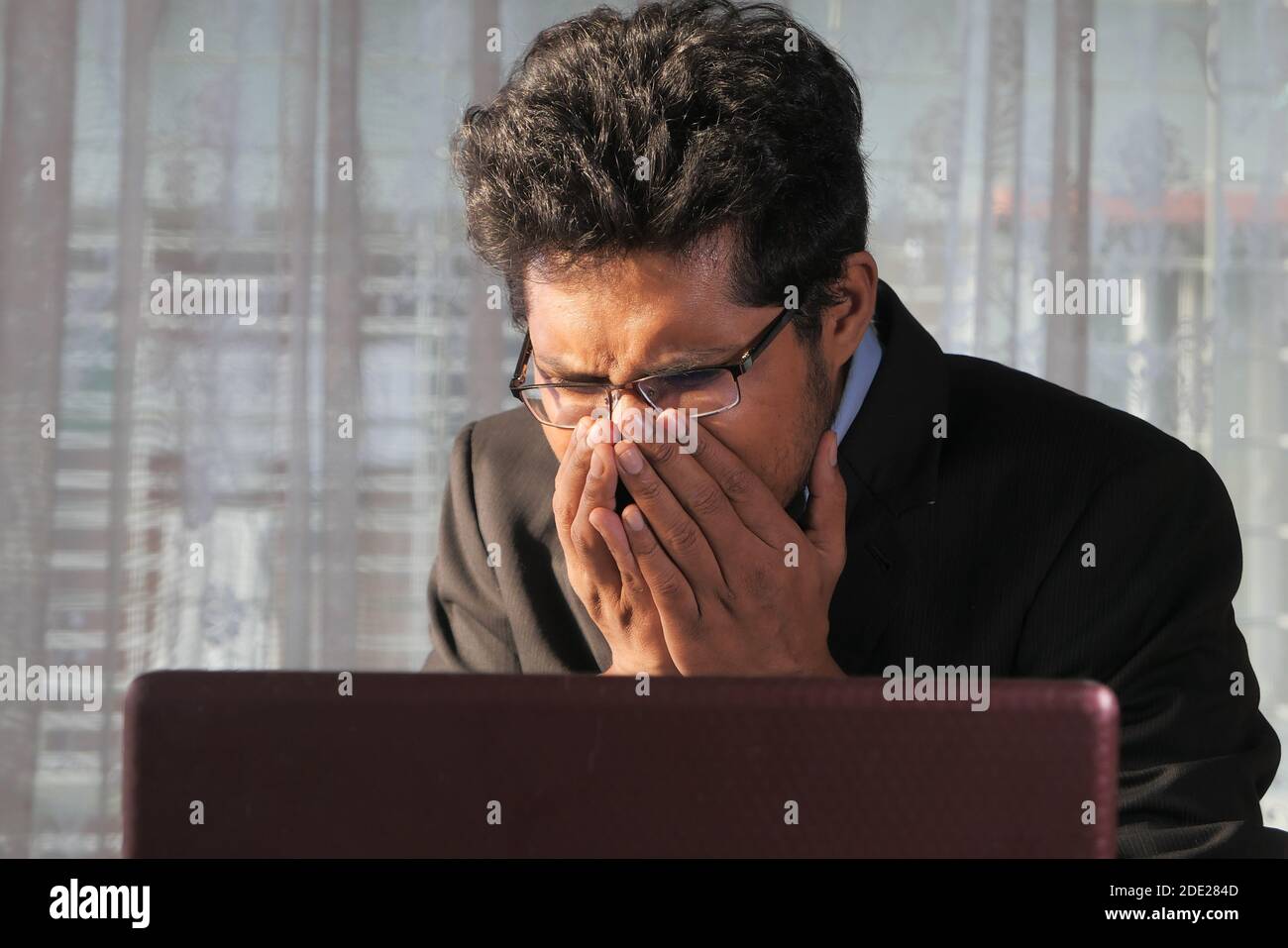 Businessman sick working on laptop hi-res stock photography and images ...