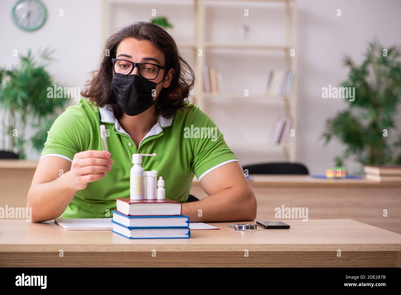 Young man student studying at the home in self-isolation concept Stock ...