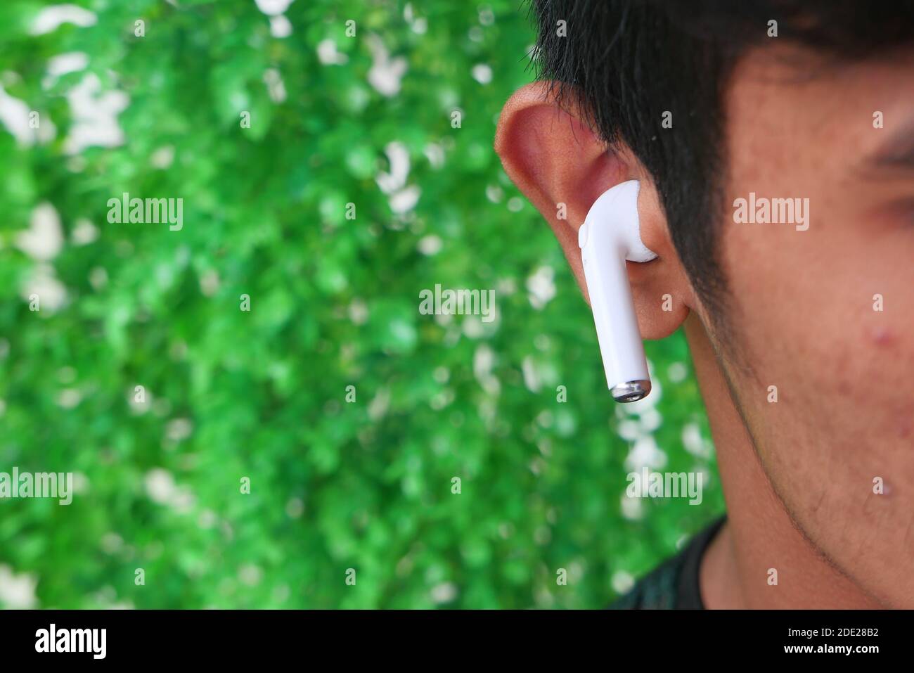Young man hearing aid hi-res stock photography and images - Alamy