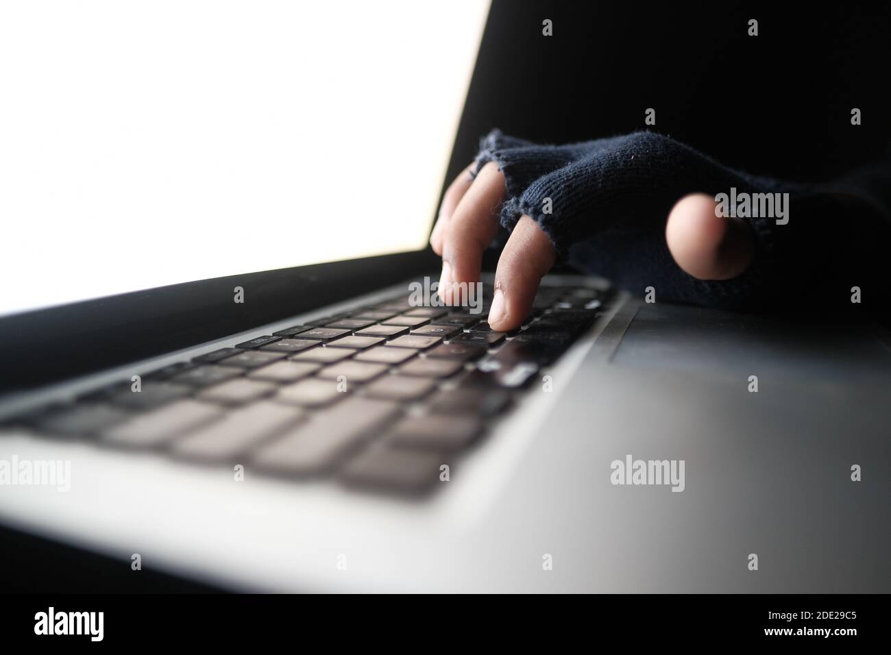 hacker hand stealing data from laptop top down Stock Photo - Alamy
