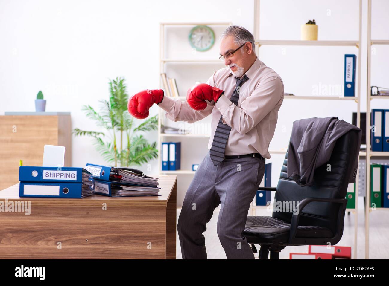 Businessman angry and furious at his workplace Stock Photo - Alamy