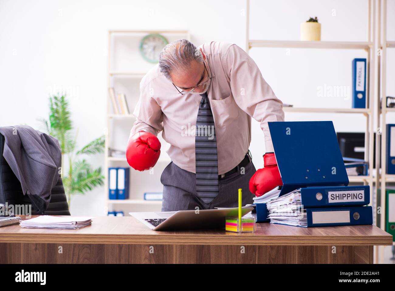 Businessman angry and furious at his workplace Stock Photo - Alamy