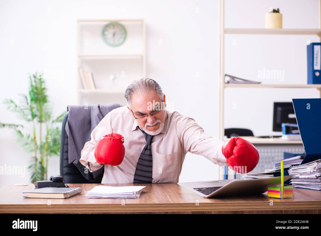 Businessman angry and furious at his workplace Stock Photo - Alamy