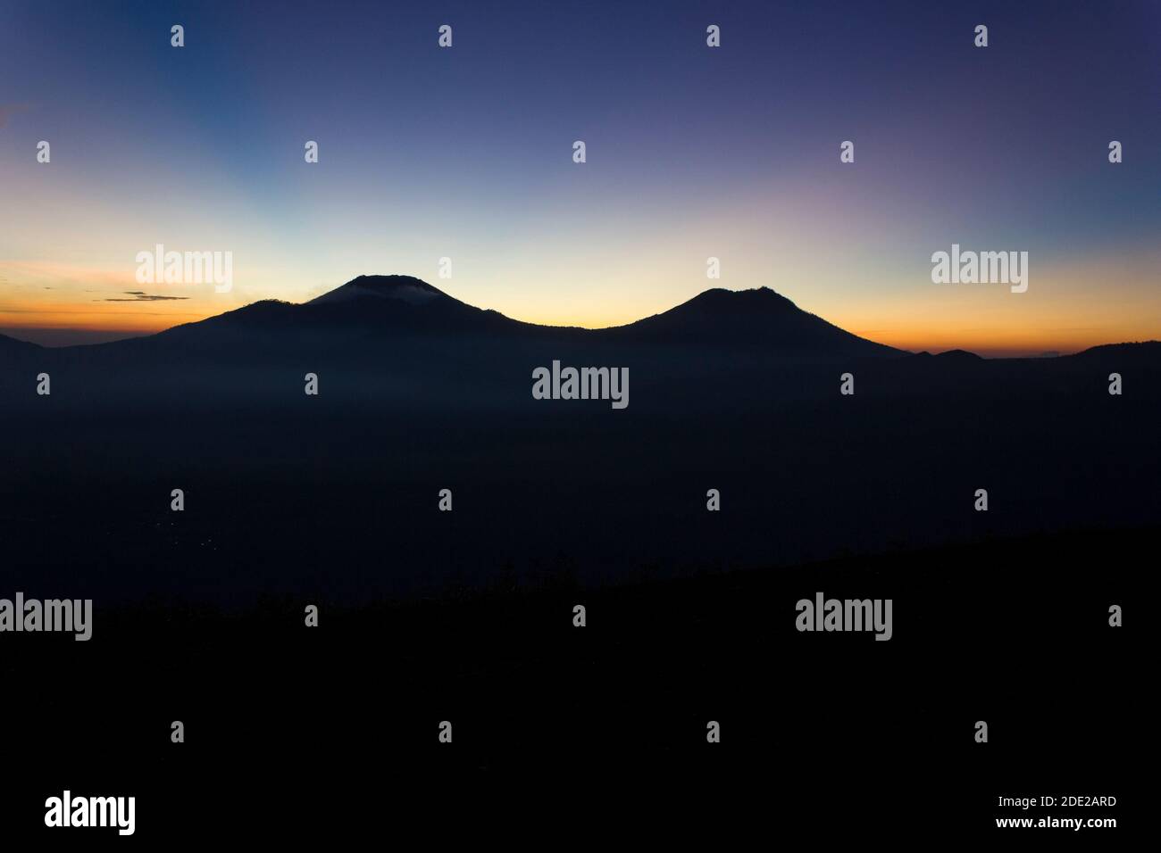 Beautiful sunrise on Puncak Megasari Stock Photo - Alamy