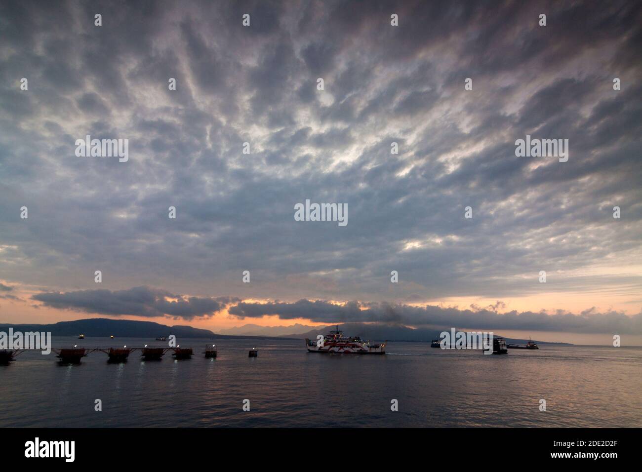 One morning in the Bali strait Stock Photo - Alamy