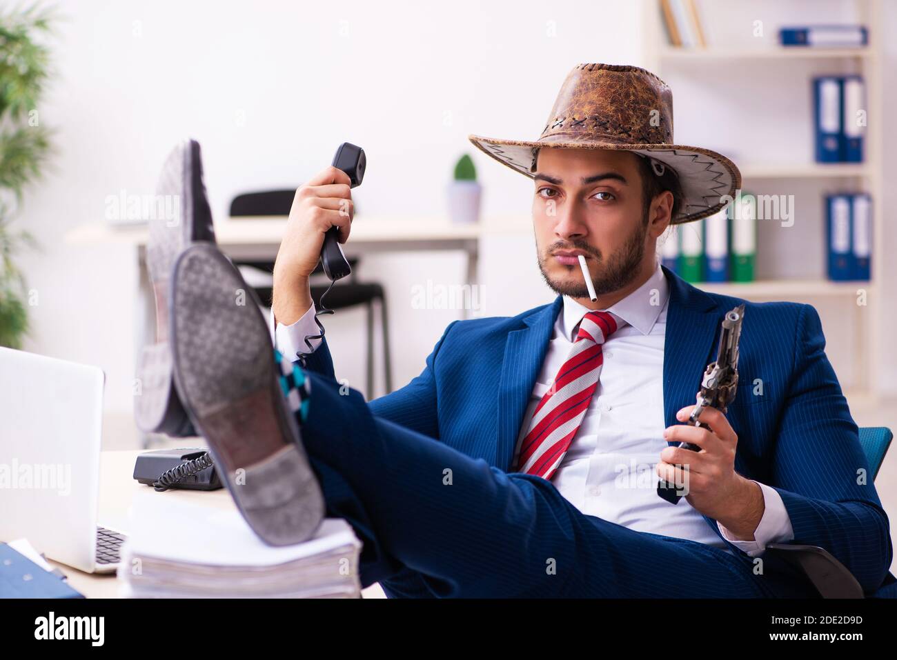 Young cowboy smoking cigarette hi-res stock photography and images - Alamy