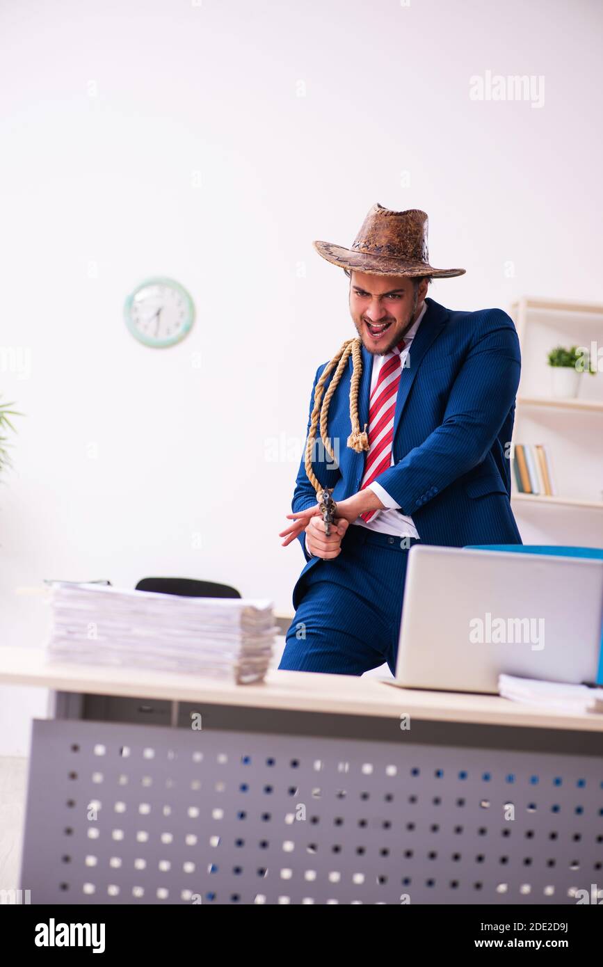 Angry businessman aiming gun hi-res stock photography and images - Alamy