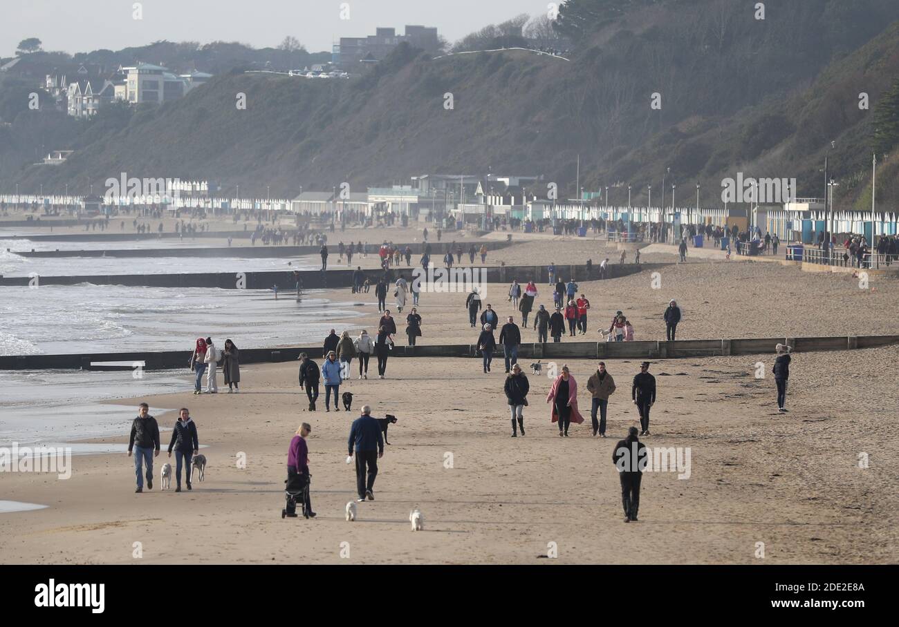 People make their way along Bournemouth beach in Dorset Stock Photo - Alamy