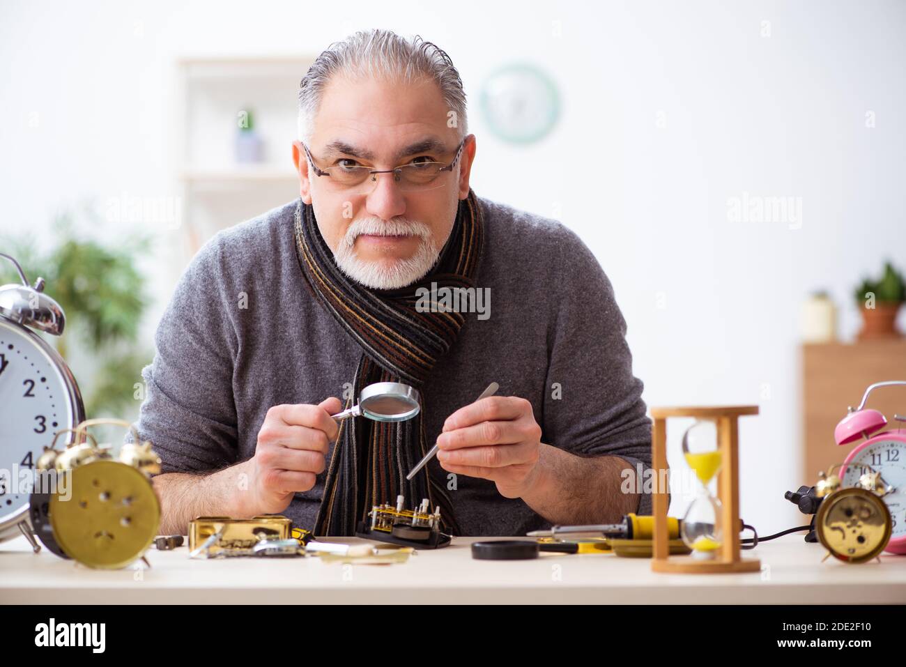 Watchmaker with loupe hi-res stock photography and images - Alamy