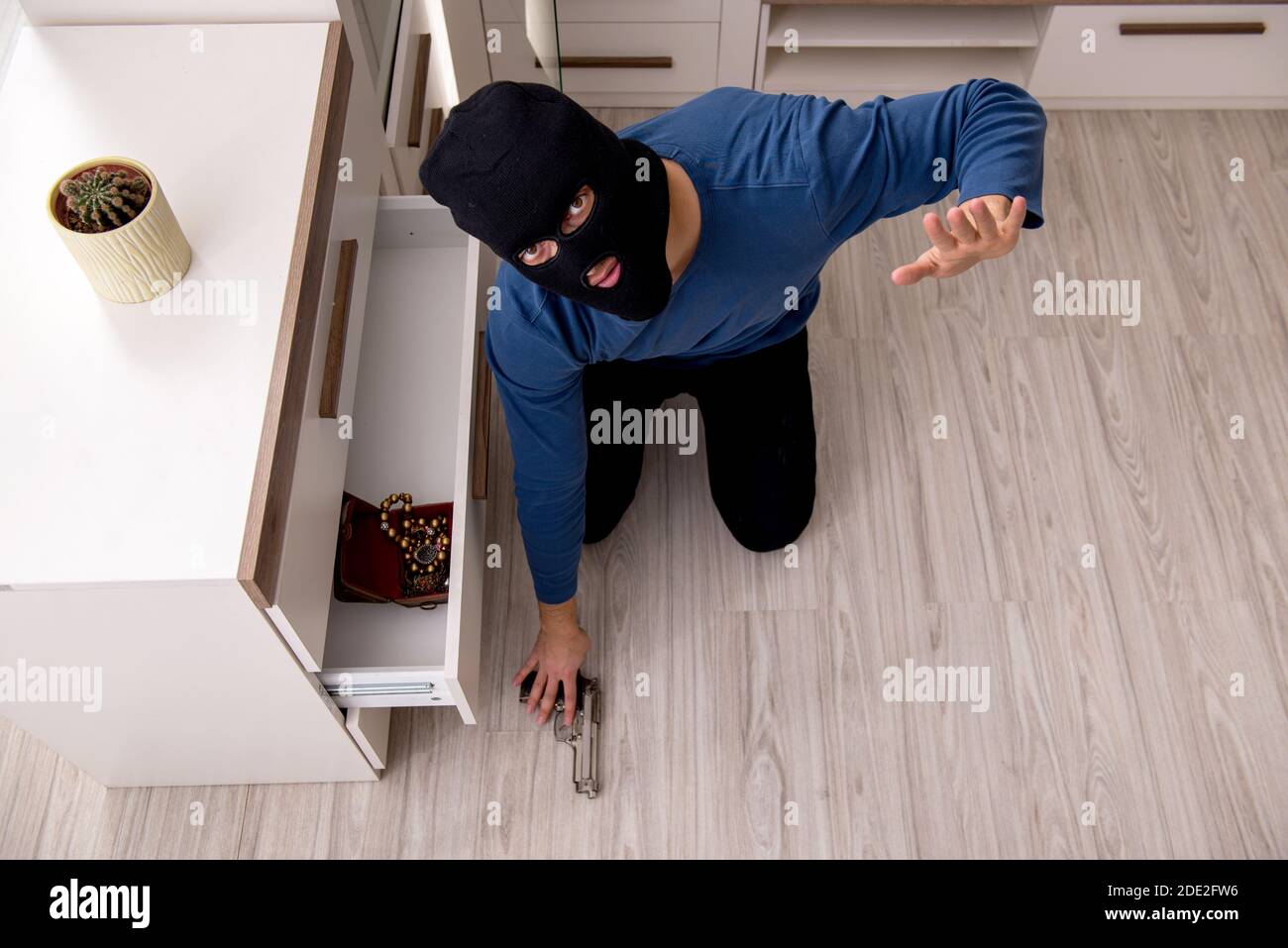 Stealing money hidden home hi-res stock photography and images - Alamy