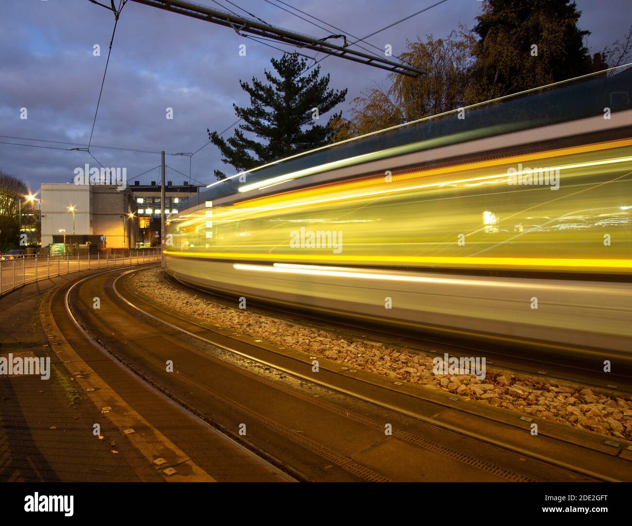 Long exposure of a tram moving at night Stock Photo - Alamy