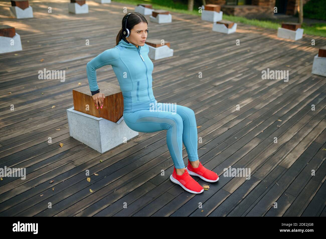 Training in park, woman doing fitness exercises Stock Photo - Alamy