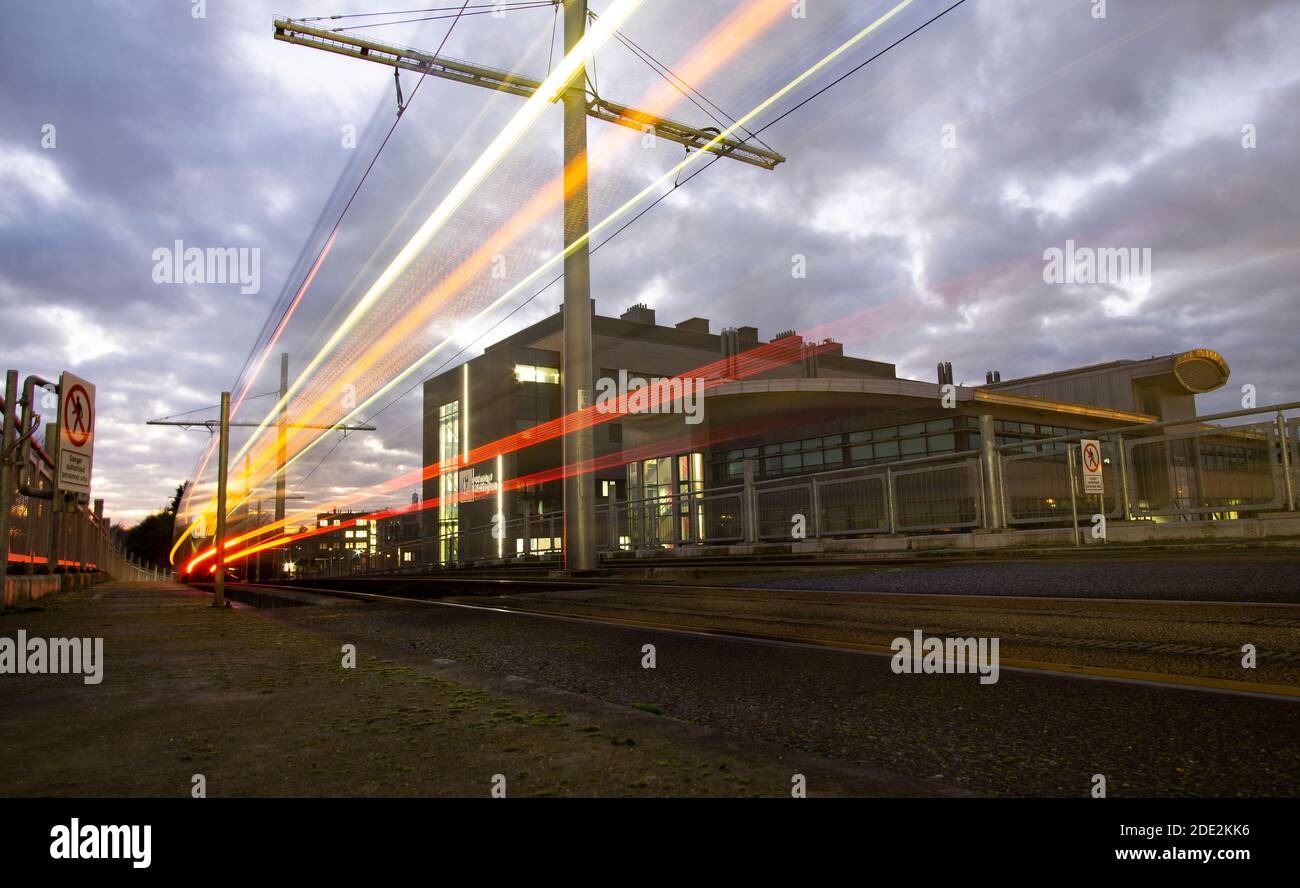 Long exposure of a tram moving at night Stock Photo - Alamy
