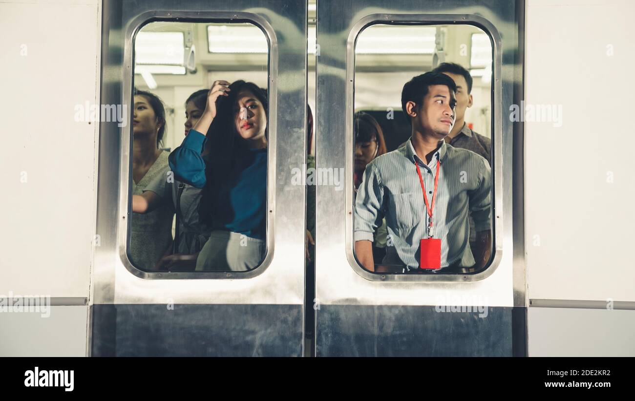 Many people crowded into a full subway hi-res stock photography and ...