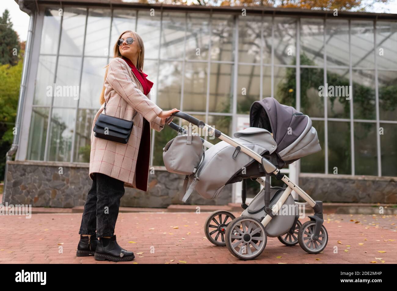 Woman stroller walking back hi-res stock photography and images - Alamy