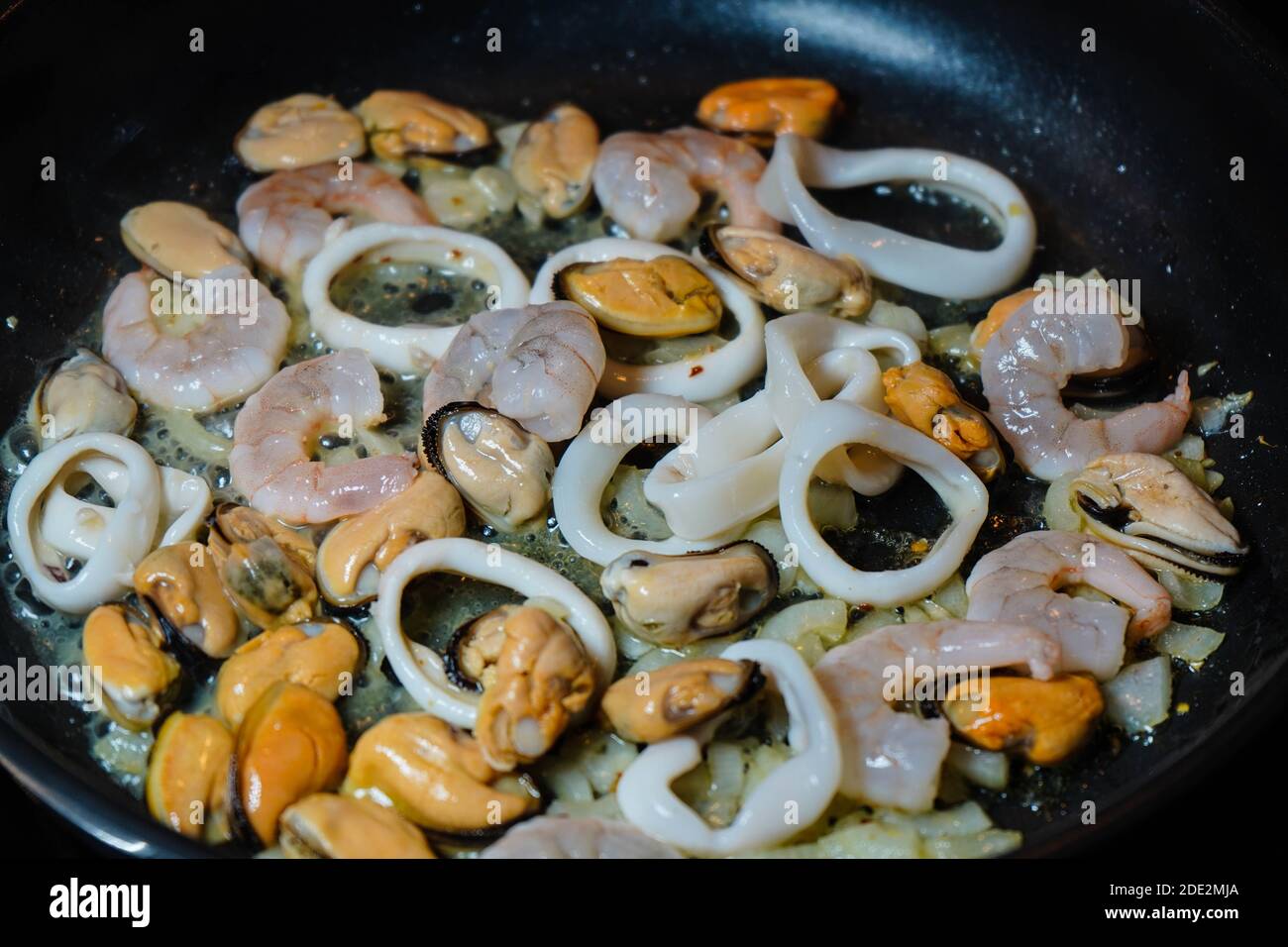 Spaghetti Rigate - black pasta with mixed seafood Stock Photo - Alamy