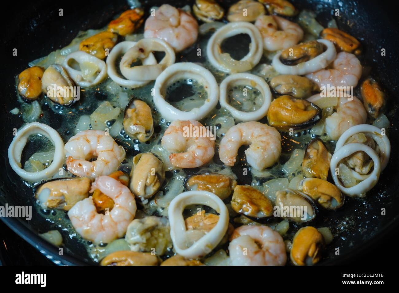 Spaghetti Rigate - black pasta with mixed seafood Stock Photo - Alamy