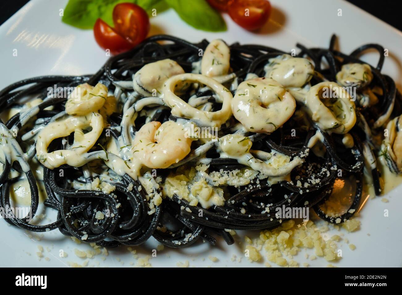 Spaghetti Rigate - black pasta with mixed seafood Stock Photo - Alamy