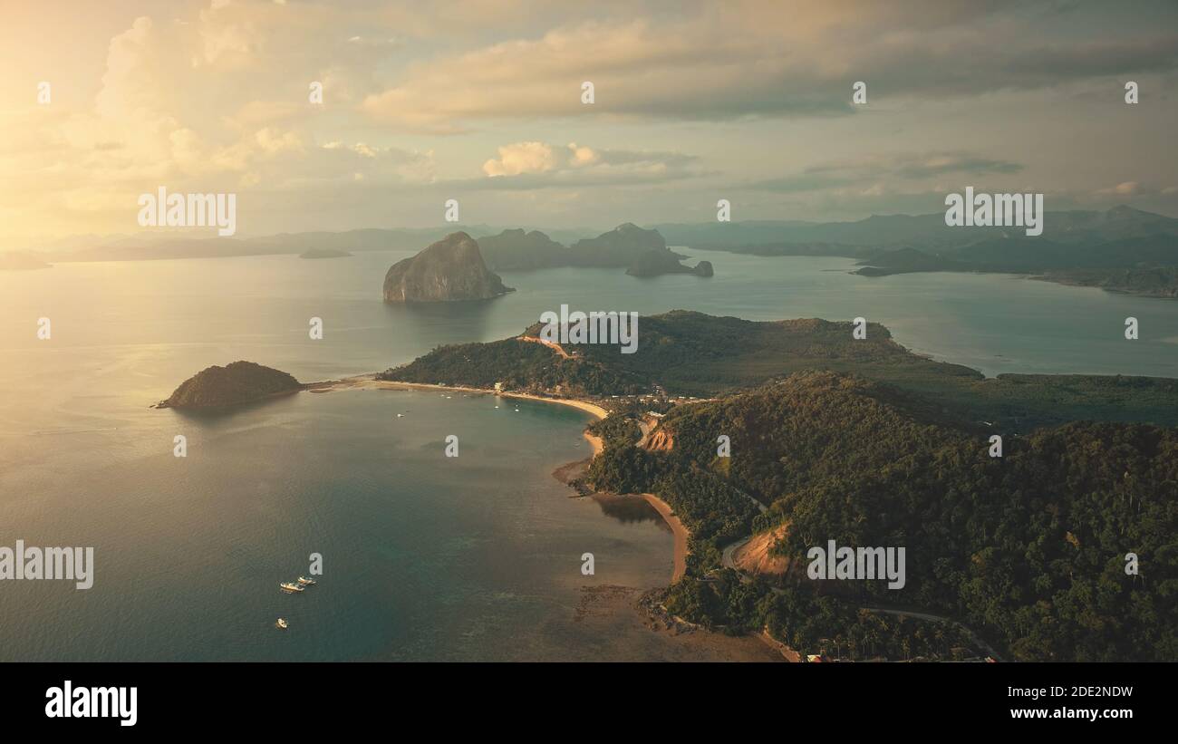 Sunrise at tropical ocean bay islands aerial view. Mountainous islet ...