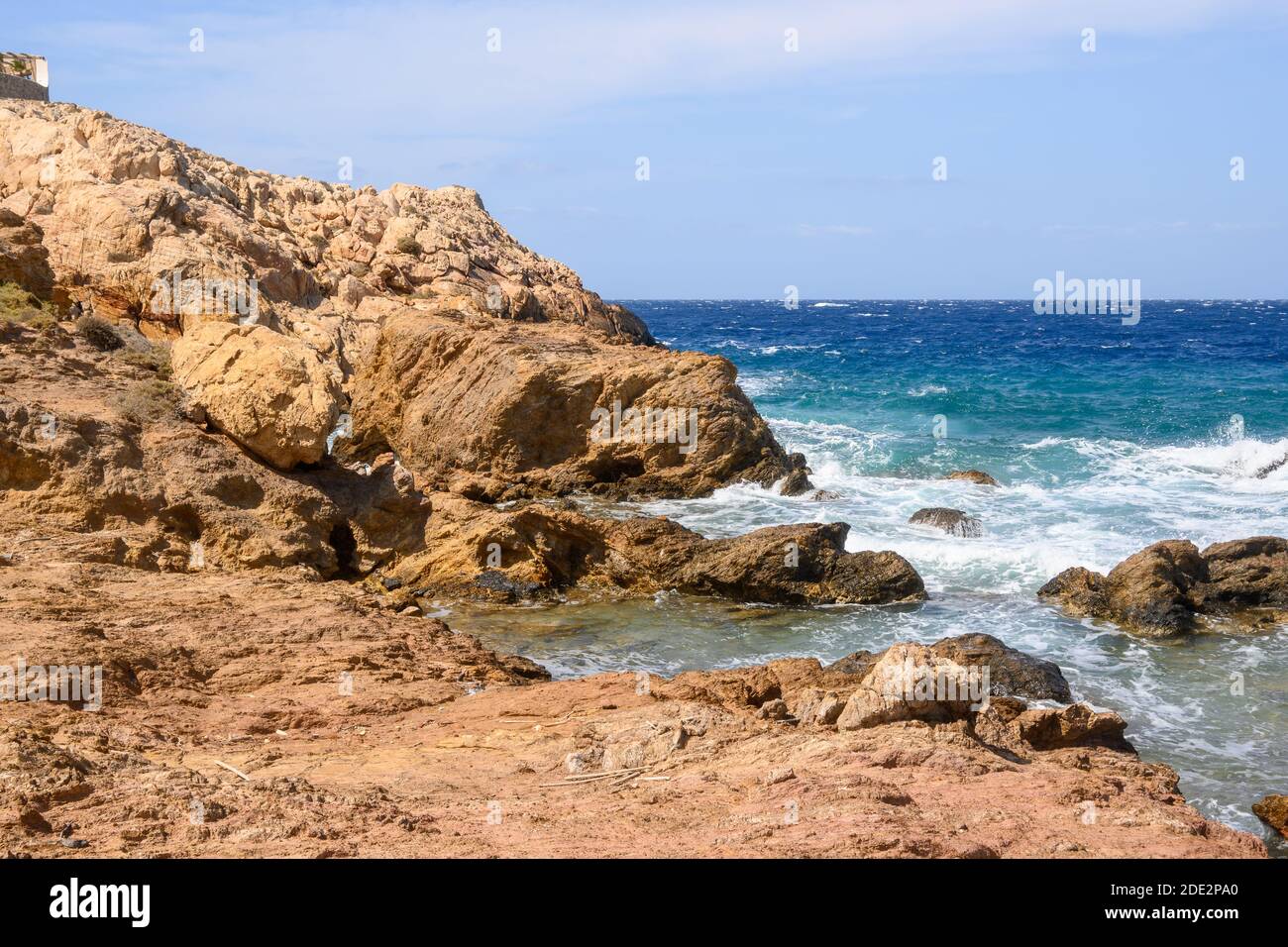 Rocky coast of Koumbara beach located on Ios Island. Cyclades, Greece ...