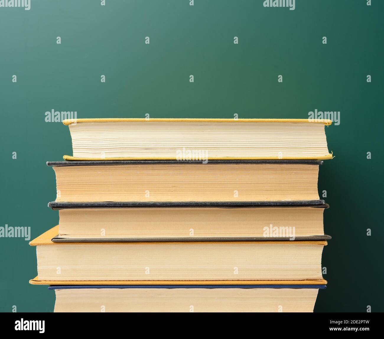 blank green chalk school board and stack of books, back to school Stock ...