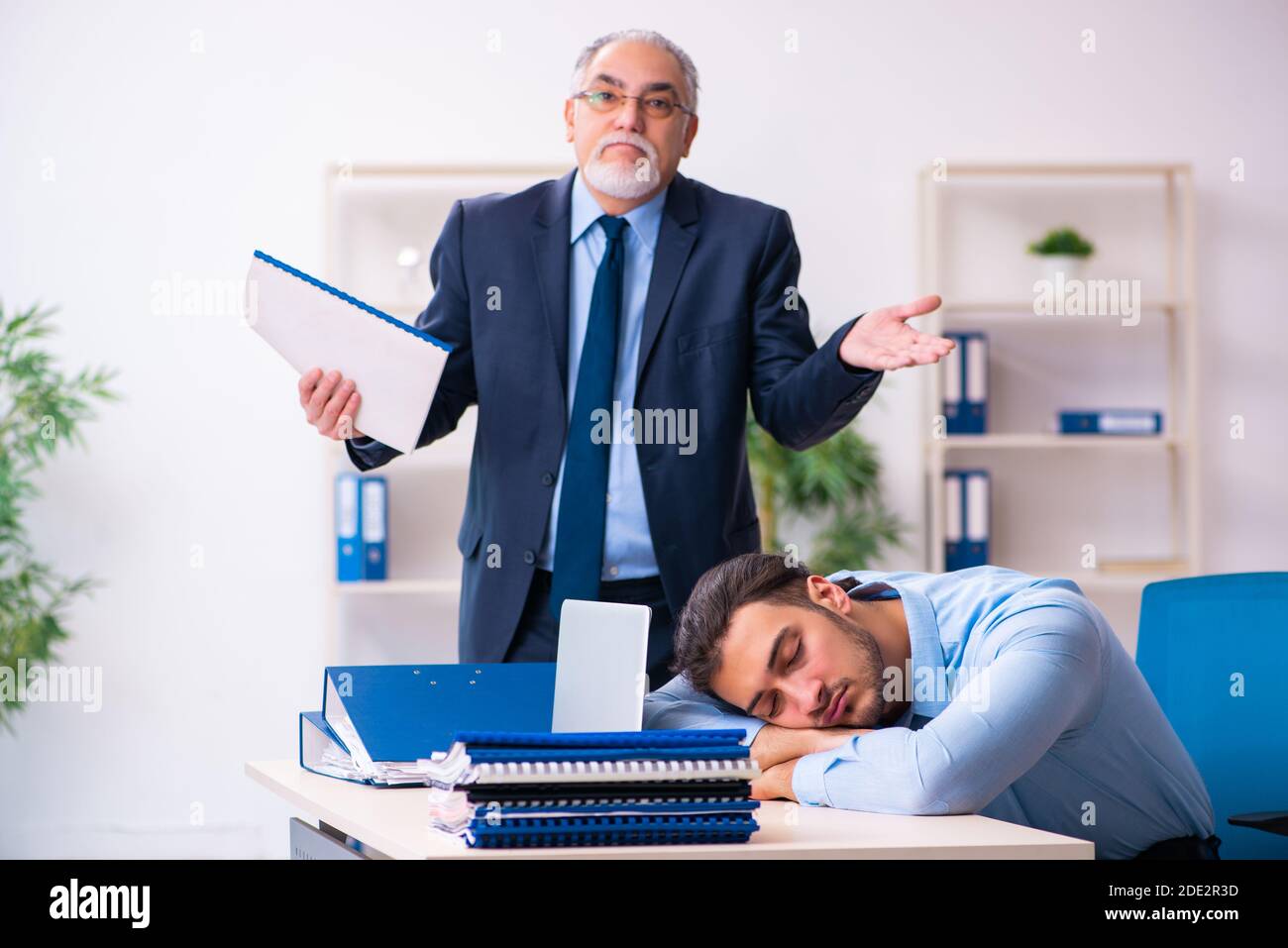 Old boss and young assistant in the office Stock Photo - Alamy