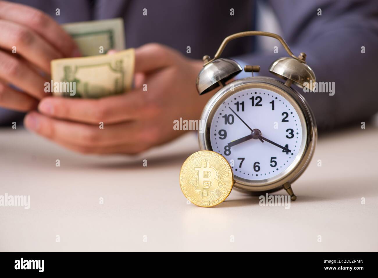 Man earning money via Internet in time management concept Stock Photo ...