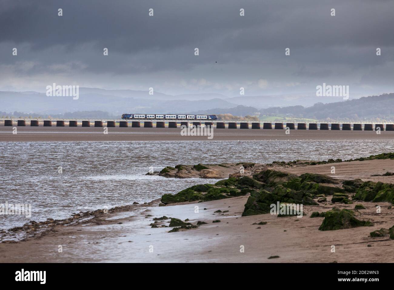 Northern Rail class CAF 195 train crossing Arnside viaduct across the ...
