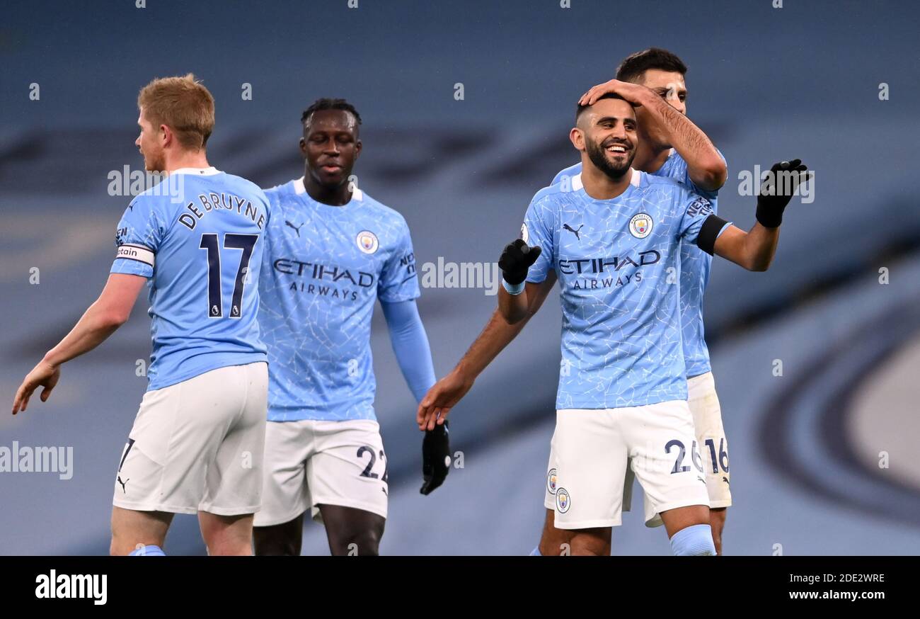 Manchester City's Riyad Mahrez (front right) celebrates scoring his ...