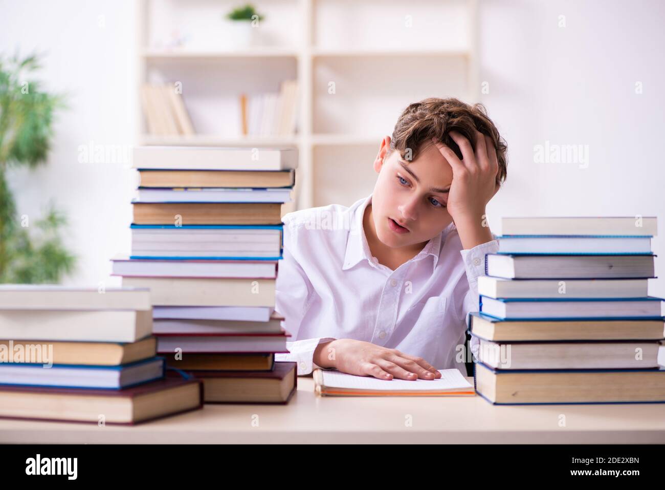 Schoolboy preparing for exam in the classroom Stock Photo - Alamy