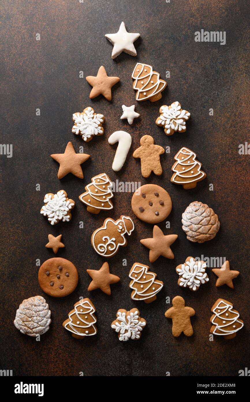 Christmas holidays homemade cookies arranged as tree on dark brown ...