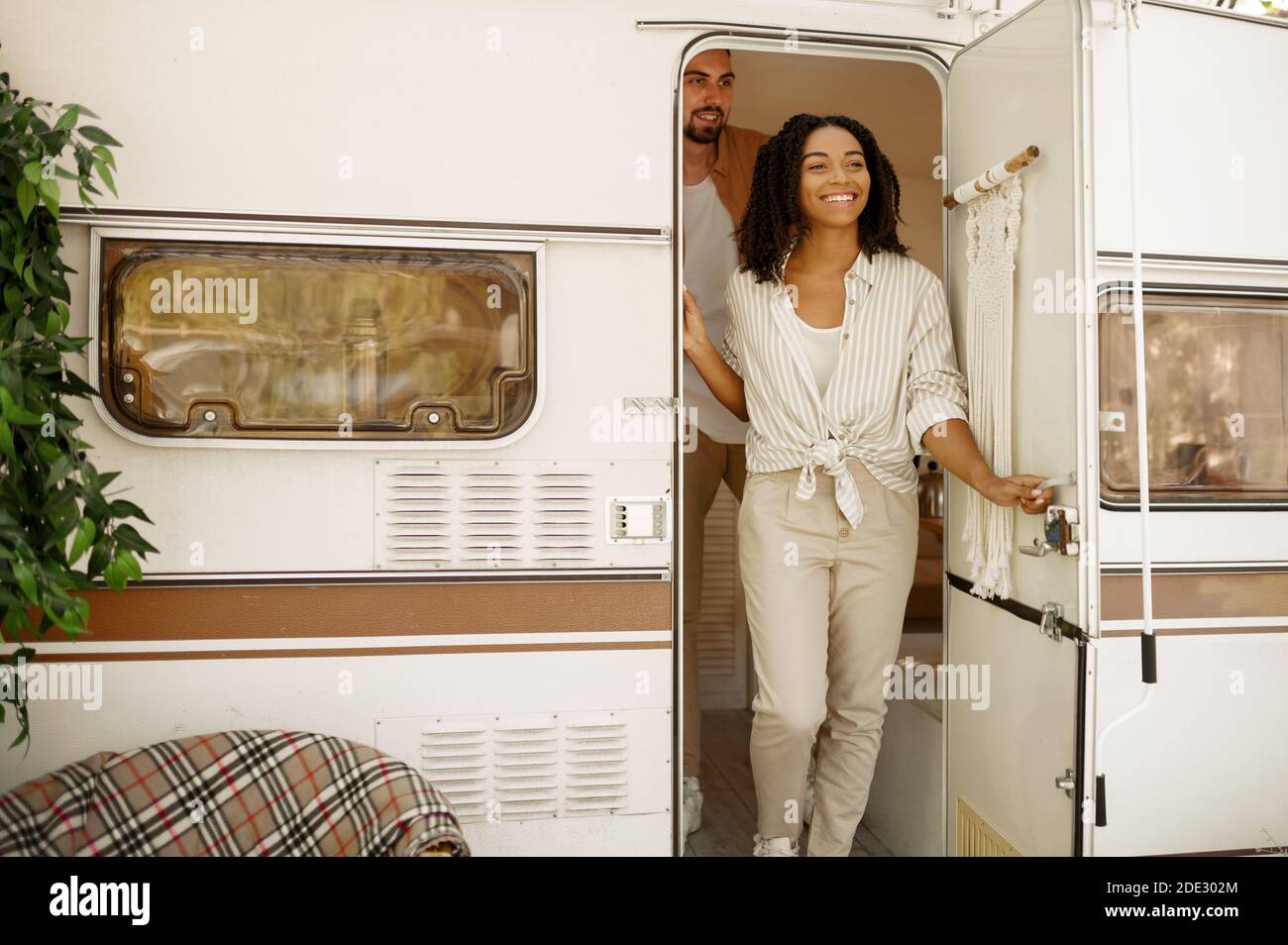 Happy woman poses at rv entrance,camp in trailer Stock Photo - Alamy