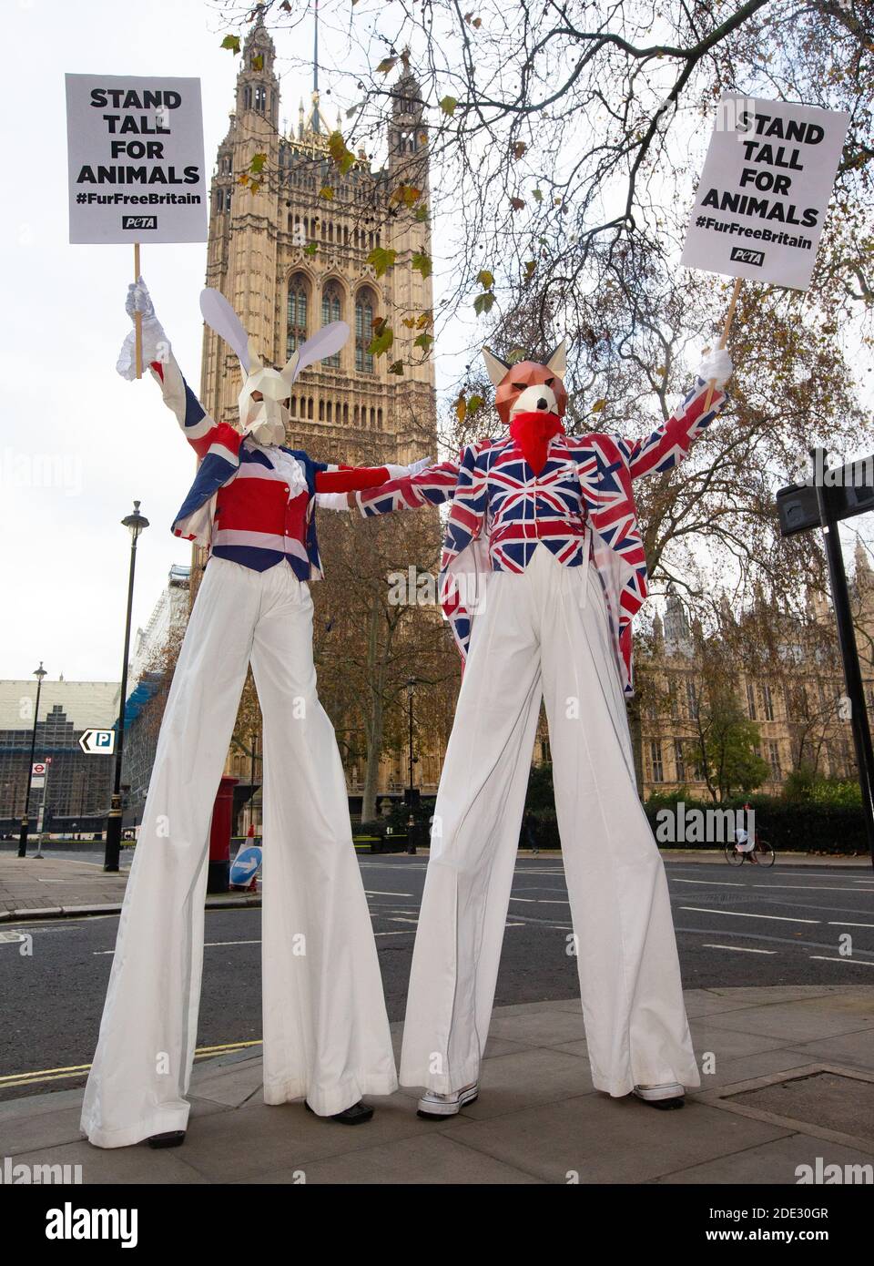 20th Anniversary of fur-free farming in the UK. Stilt-walkers dressed ...
