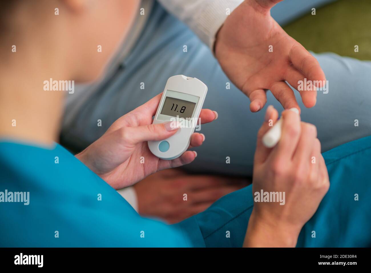 Close up picture of doctors hands holding the glucometer Stock Photo ...