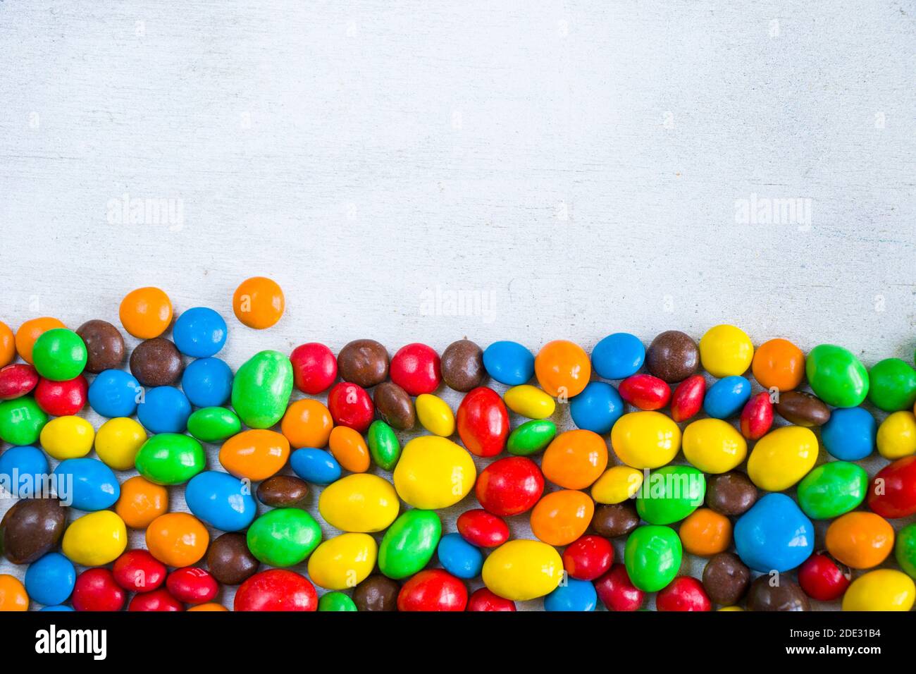 M&M's candy on the white background, colorful candy texture ...
