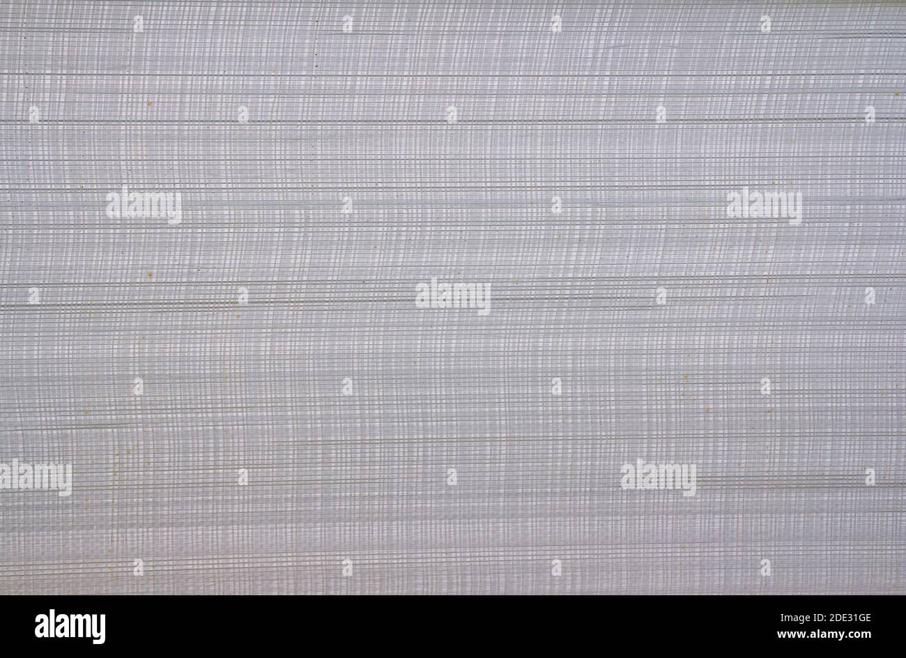 Close up white polypropylene woven fabric texture. Abstract background ...