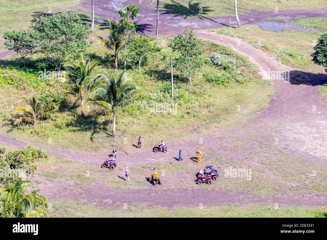 Tourists riding ATVs near the Chocolate Hills in Bohol, Philippines ...